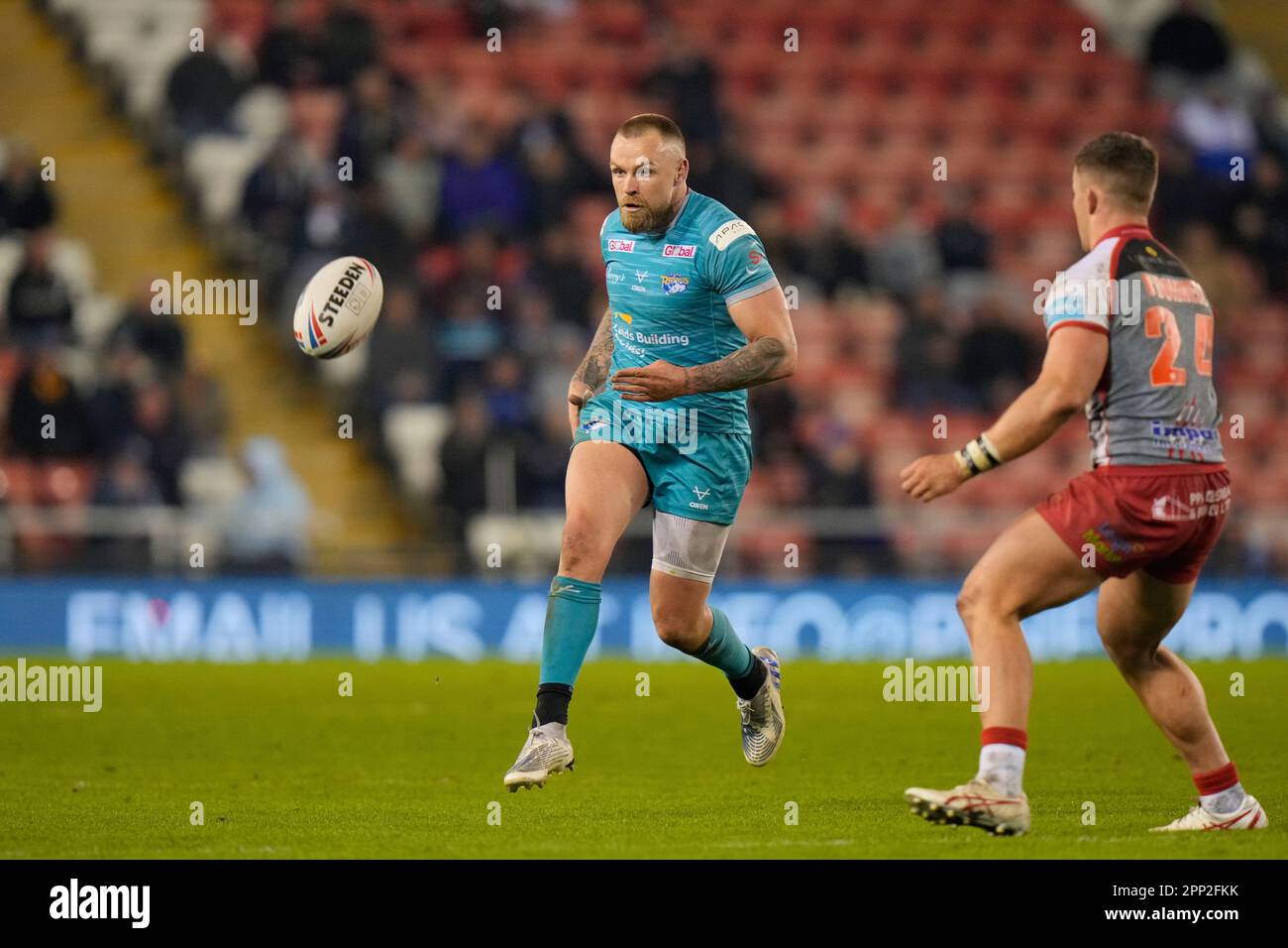 Blake Austin #6 of Leeds Rhinos kicks through during the Betfred Super ...
