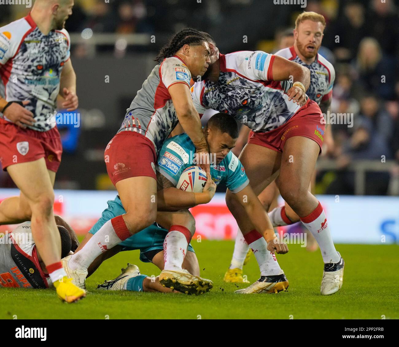 Sam Lisone #15 of Leeds Rhinos runs at the Leigh Leopards defence ...