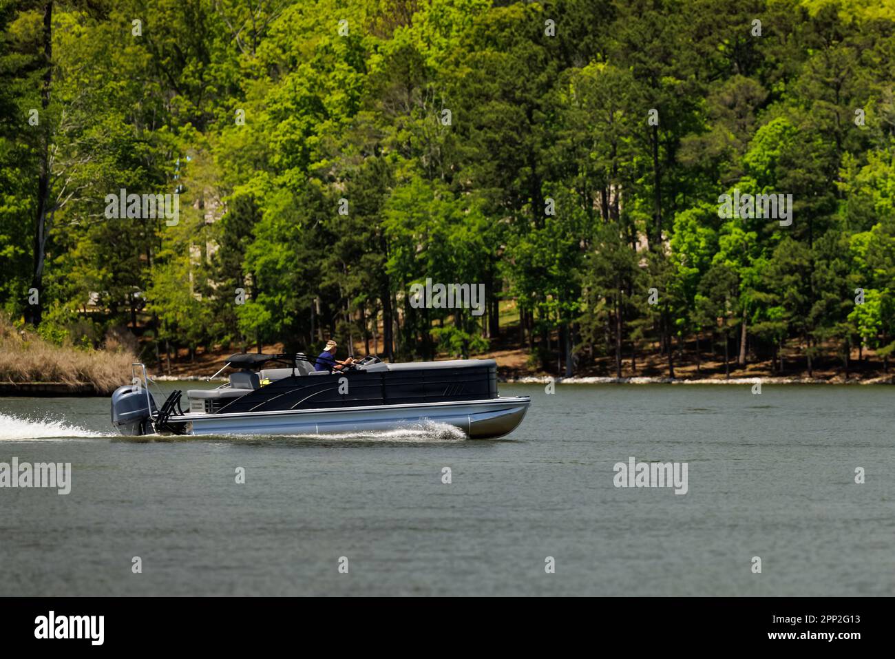 Boater on pontoon boat enjoying summer day on Lake. Pontoon party boat ...