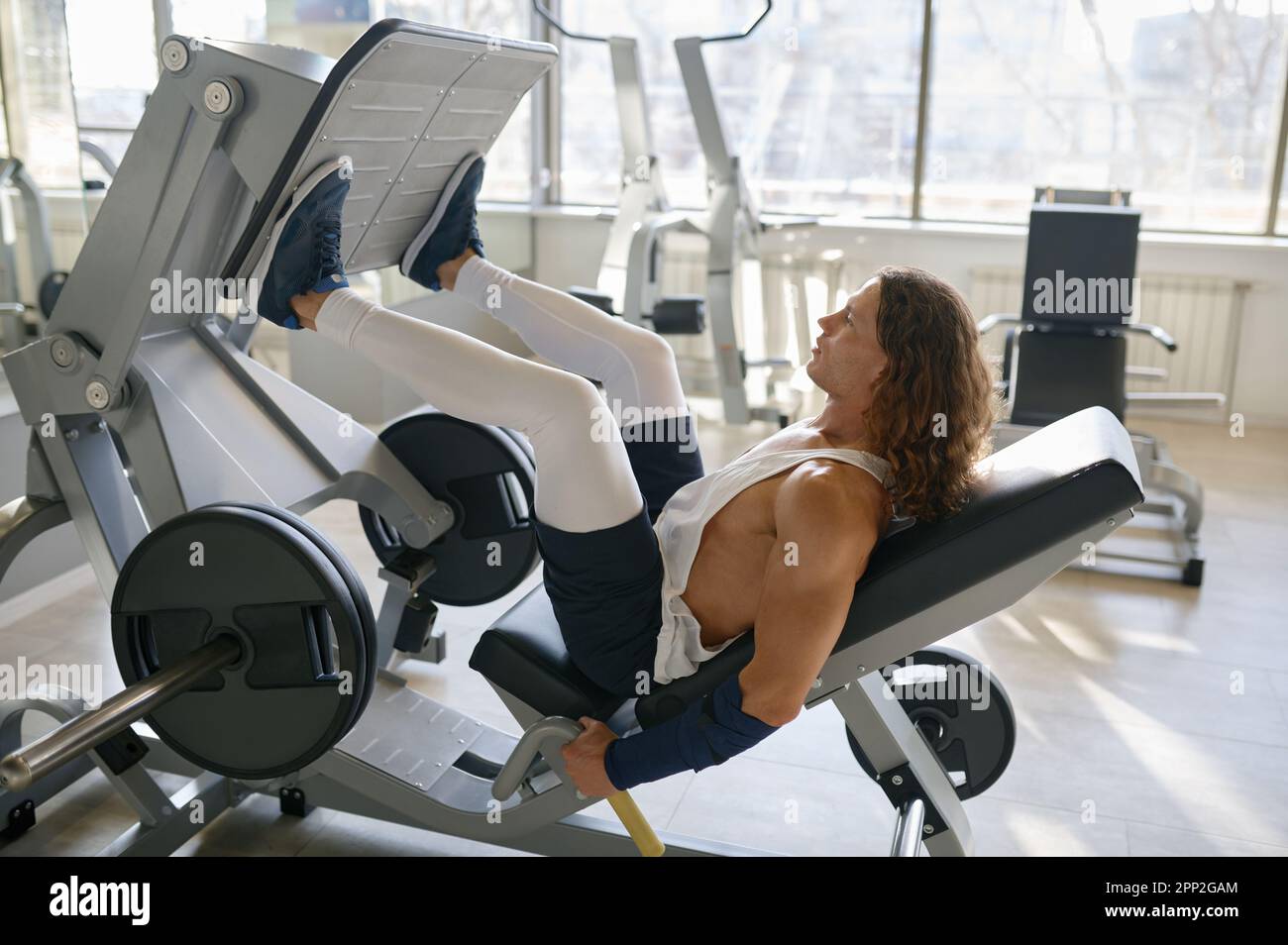 Male bodybuilder flexing muscles side hi-res stock photography and ...