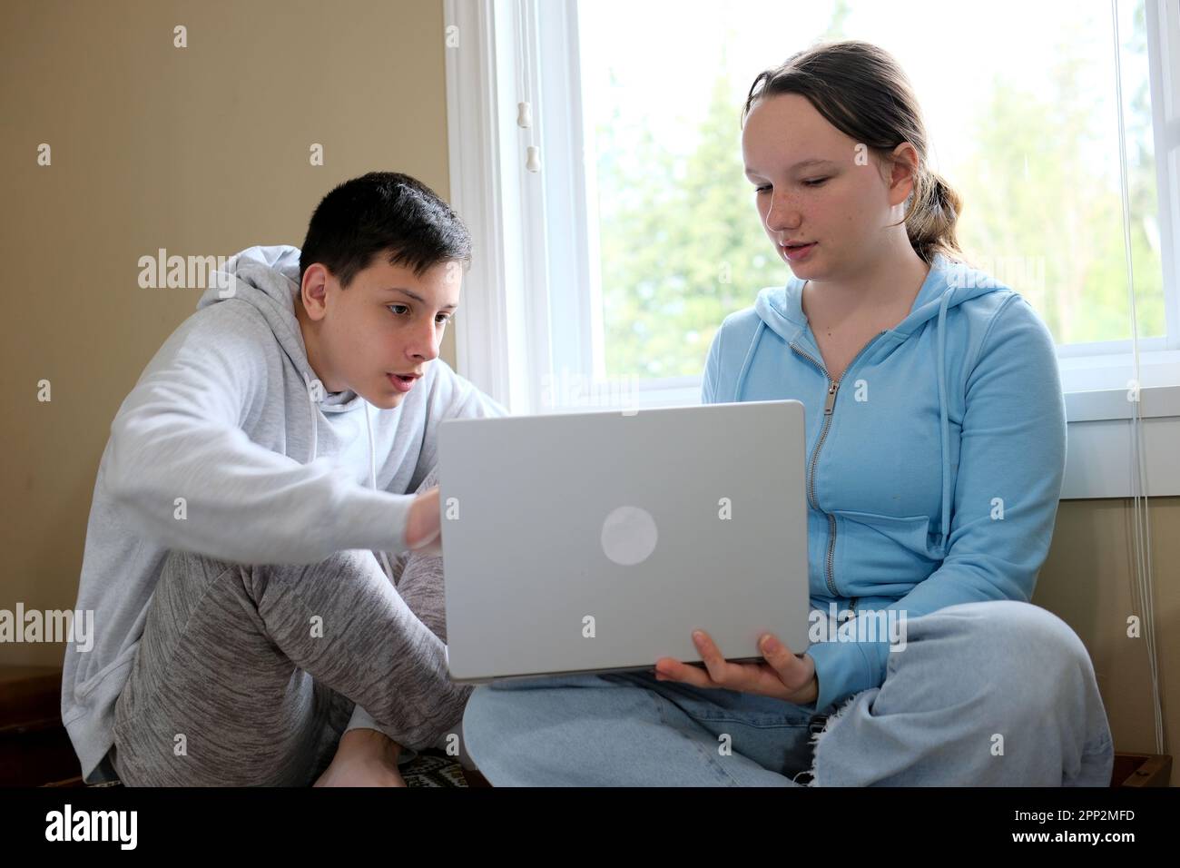 explain lesson boy showing girl on computer helping study friends older ...