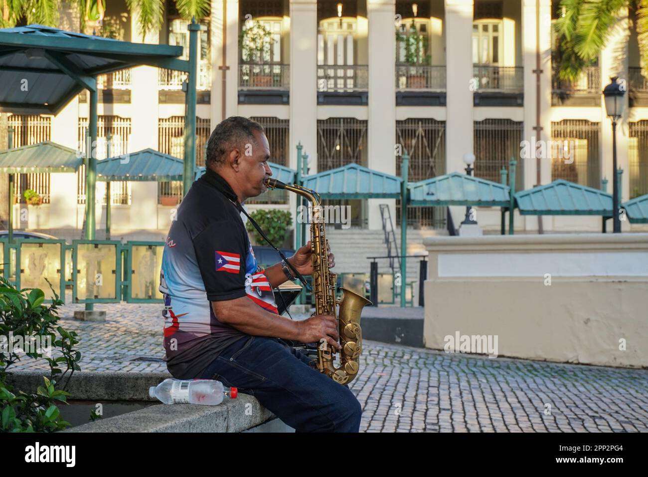 Emilio Vázquez plays saxophone on Paseo de la Princesa in Old San Juan ...