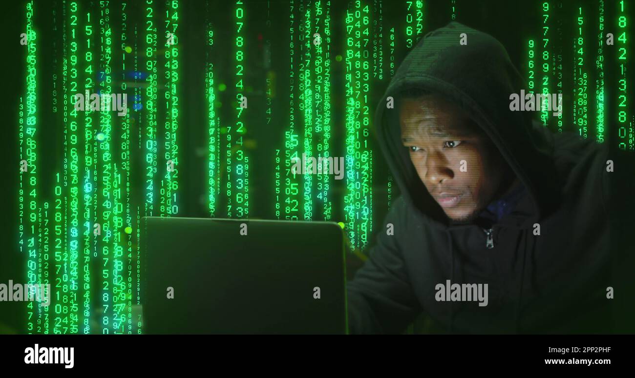 Composition of data processing over african american male hacker using laptop in server room ...