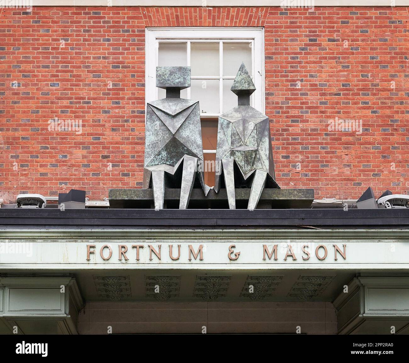 Contemporary, stylised statues of a couple at Fortnum & Mason shop ...