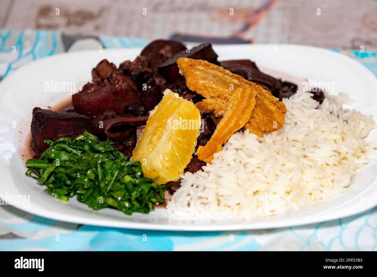 Traditional Brazilian feijoada served on plate Stock Photo - Alamy