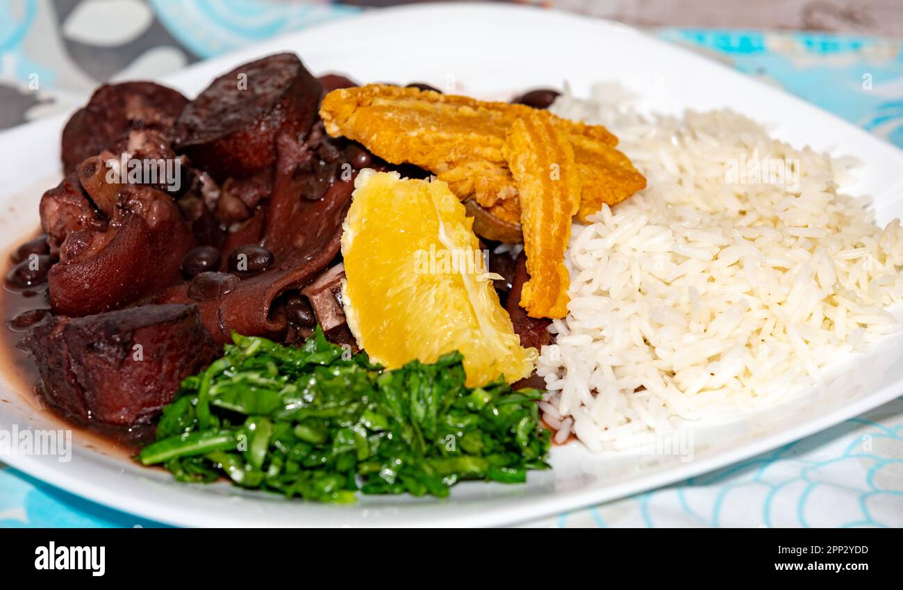 Traditional Brazilian feijoada served on plate Stock Photo - Alamy