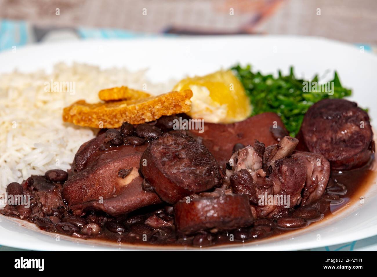 Traditional Brazilian feijoada served on plate Stock Photo - Alamy