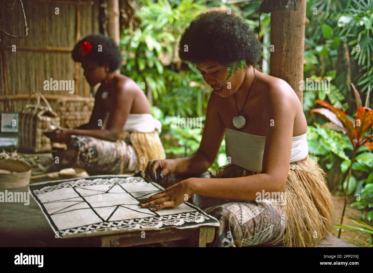 Women applying designs to tapa cloth, Pacific Harbour Cultural Centre ...
