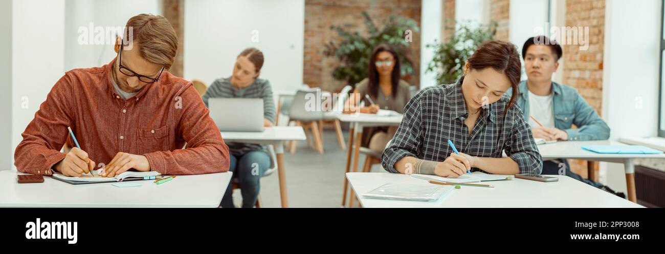 Group of university students taking a test Stock Photo - Alamy