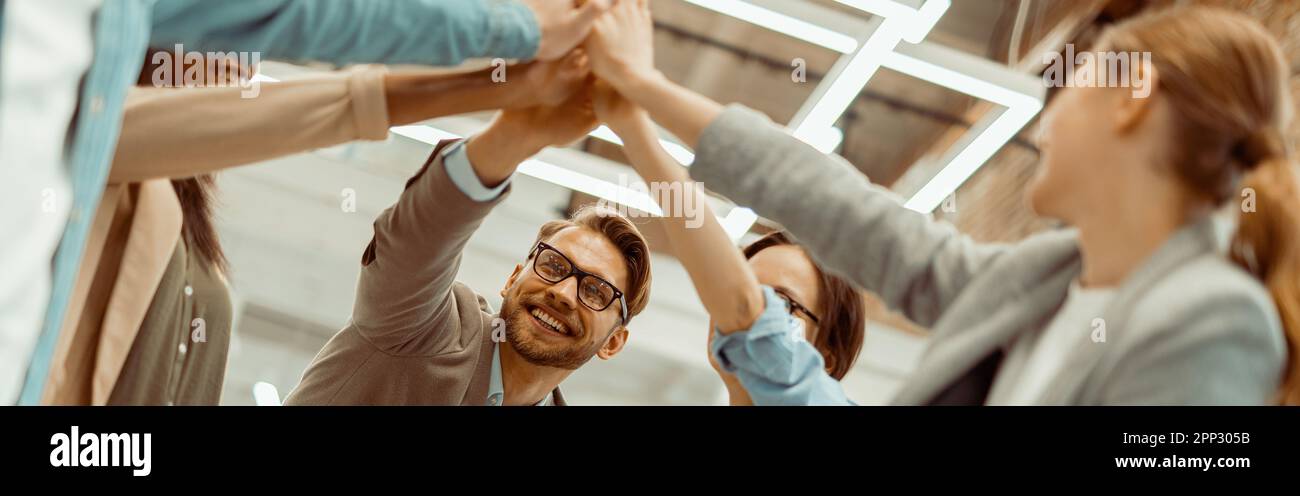 Business people giving five to their colleague in the office Stock ...