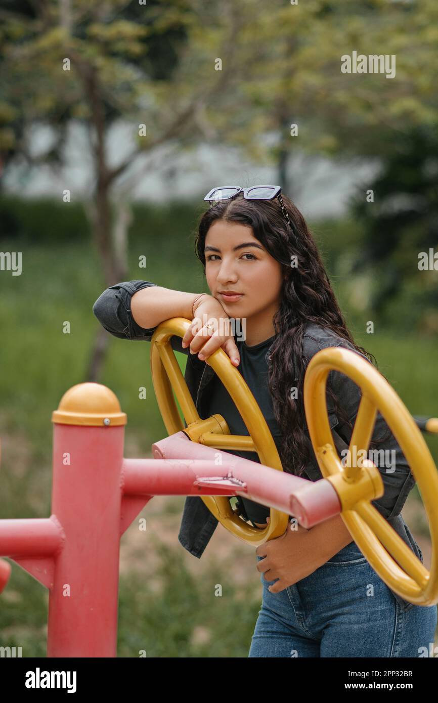 female portrait session in the field surrounded by flowers and lots of ...