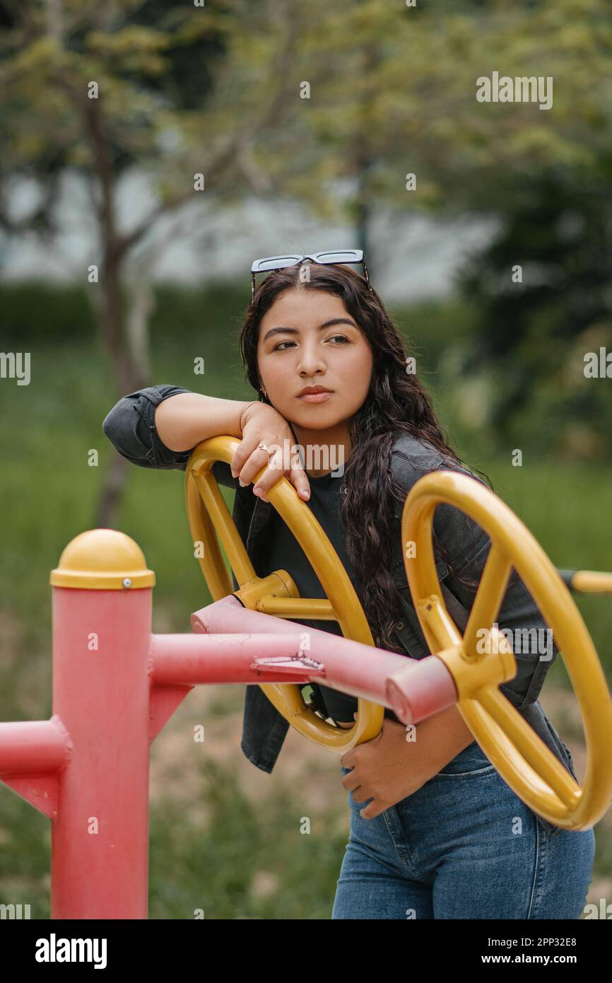 female portrait session in the field surrounded by flowers and lots of ...