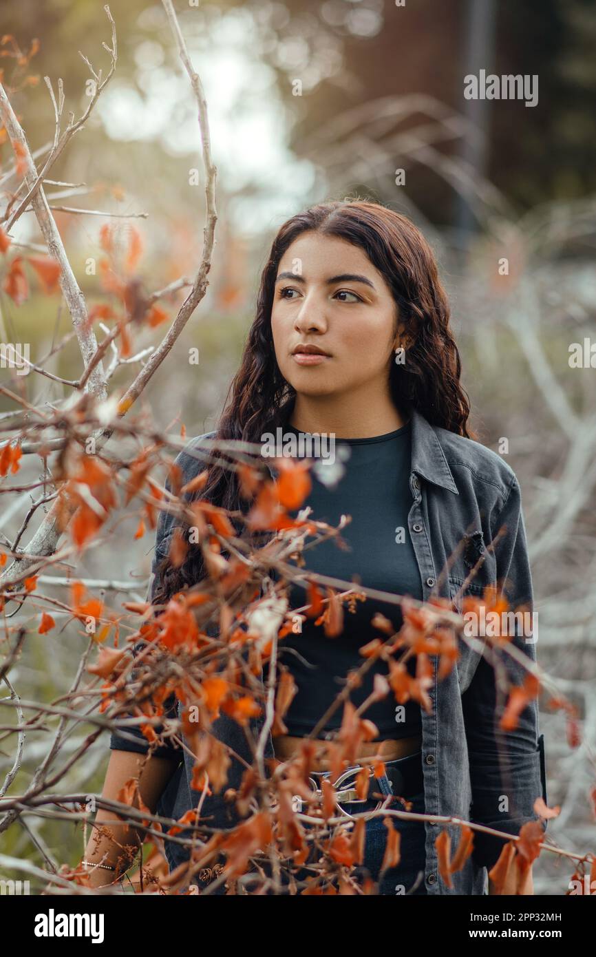 female portrait session in the field surrounded by flowers and lots of ...