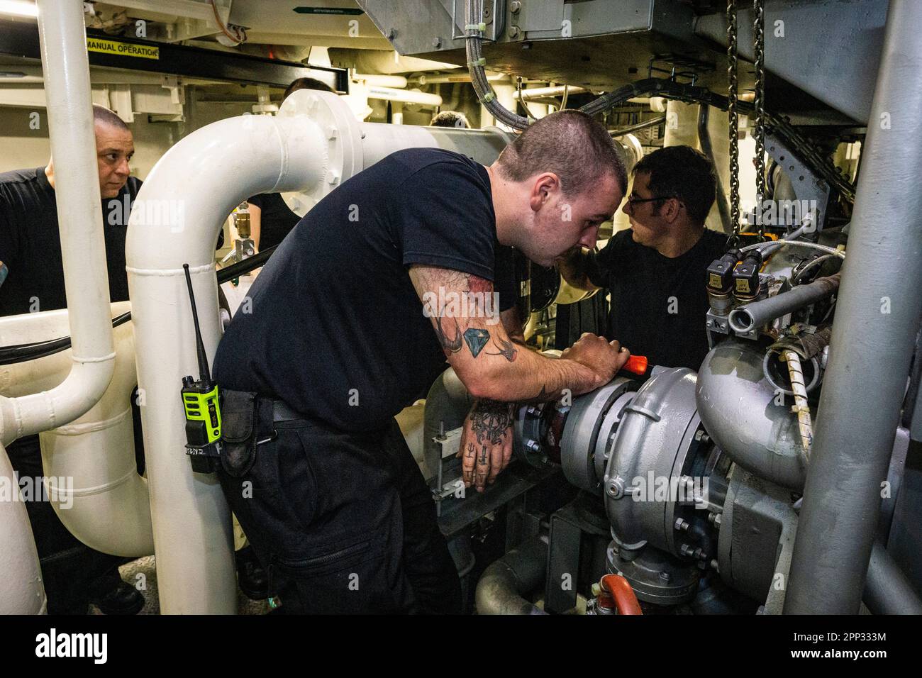Royal Canadian Navy engineering personnel onboard HMCS Margaret Brooke ...