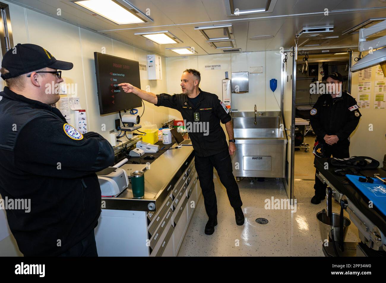 Medical staff instruct the crew during training onboard HMCS Margaret ...