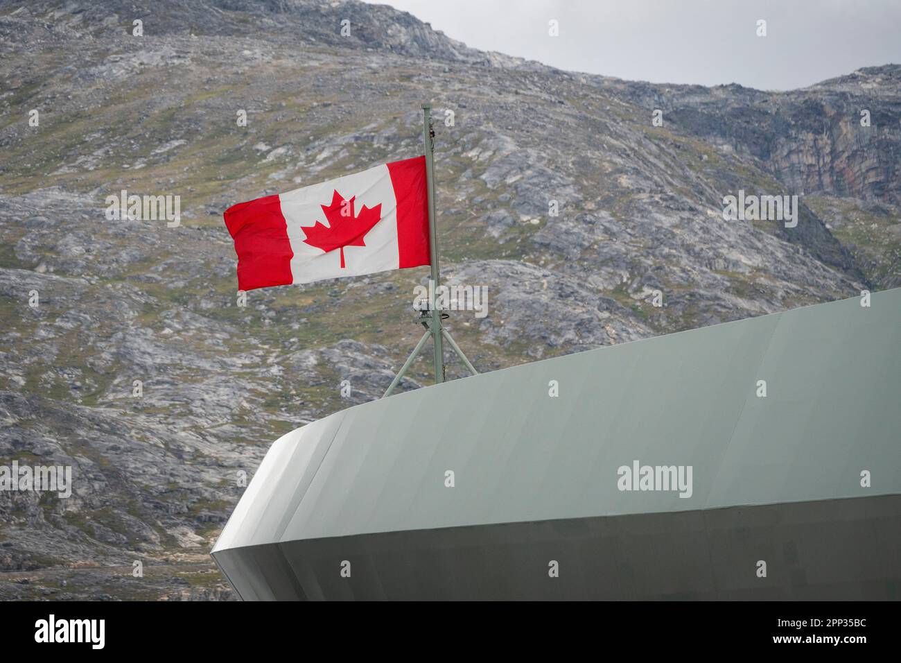 The Maple Leaf, the national flag of Canada, flies from the jackstaff ...