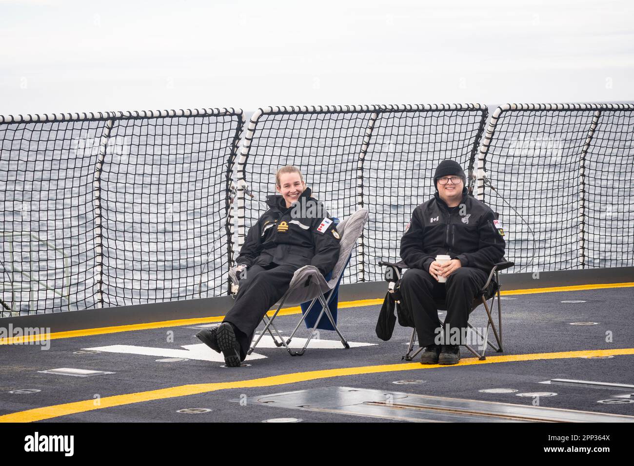 Crew members of HMCS Margaret Brooke use their free time to relax and ...