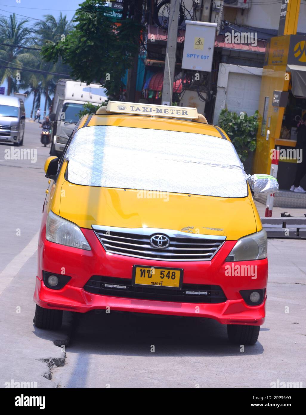 A taxi has its windscreen covered in a reflective cover in Pattaya ...