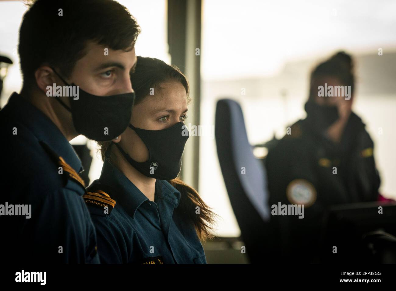 Junior Officers and Commander Nicole Robichaud (background) on the ...
