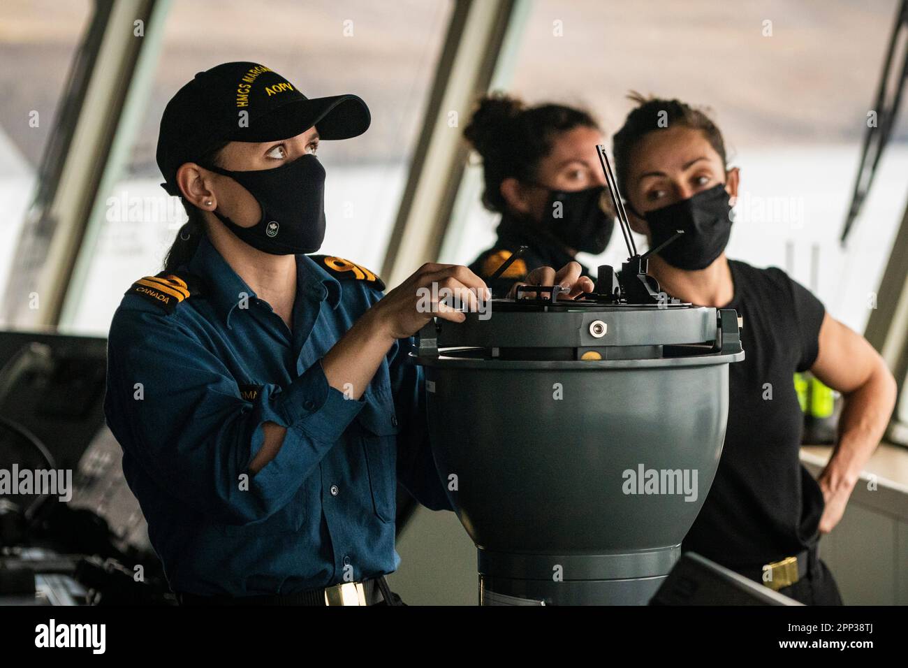 Officer taking compass bearings on the bridge of the patrol ship HMCS ...