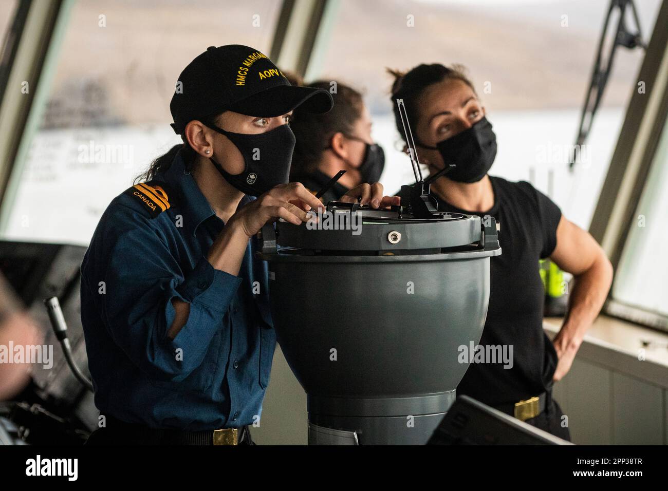 Officer taking compass bearings on the bridge of the patrol ship HMCS ...