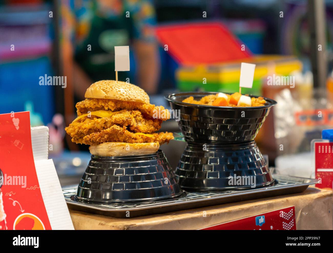 Chicken burger show on shop at a street food market Stock Photo - Alamy