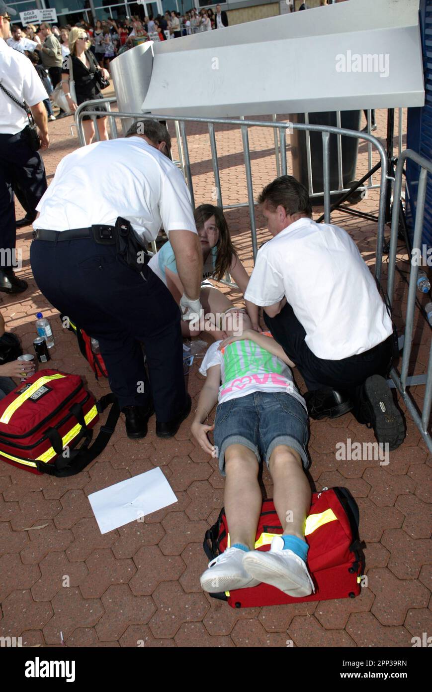 Ambulance paramedics treat a young music fan at the 2007 ARIA ...