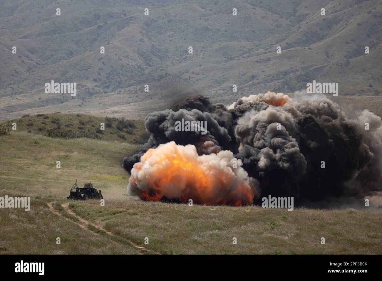 The explosives from a mine clearing line charge detanate during an ...