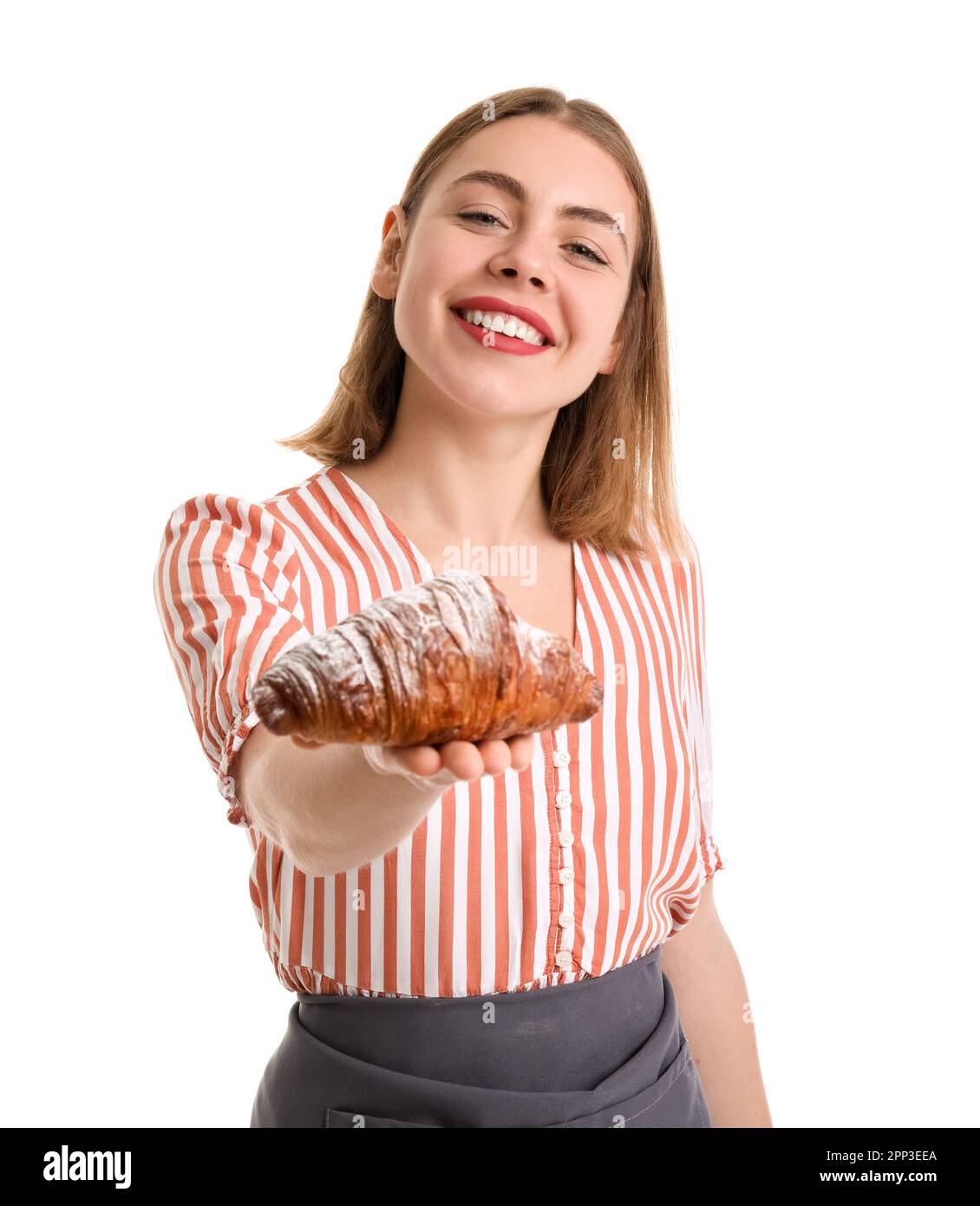 Female baker with tasty croissant on white background Stock Photo - Alamy