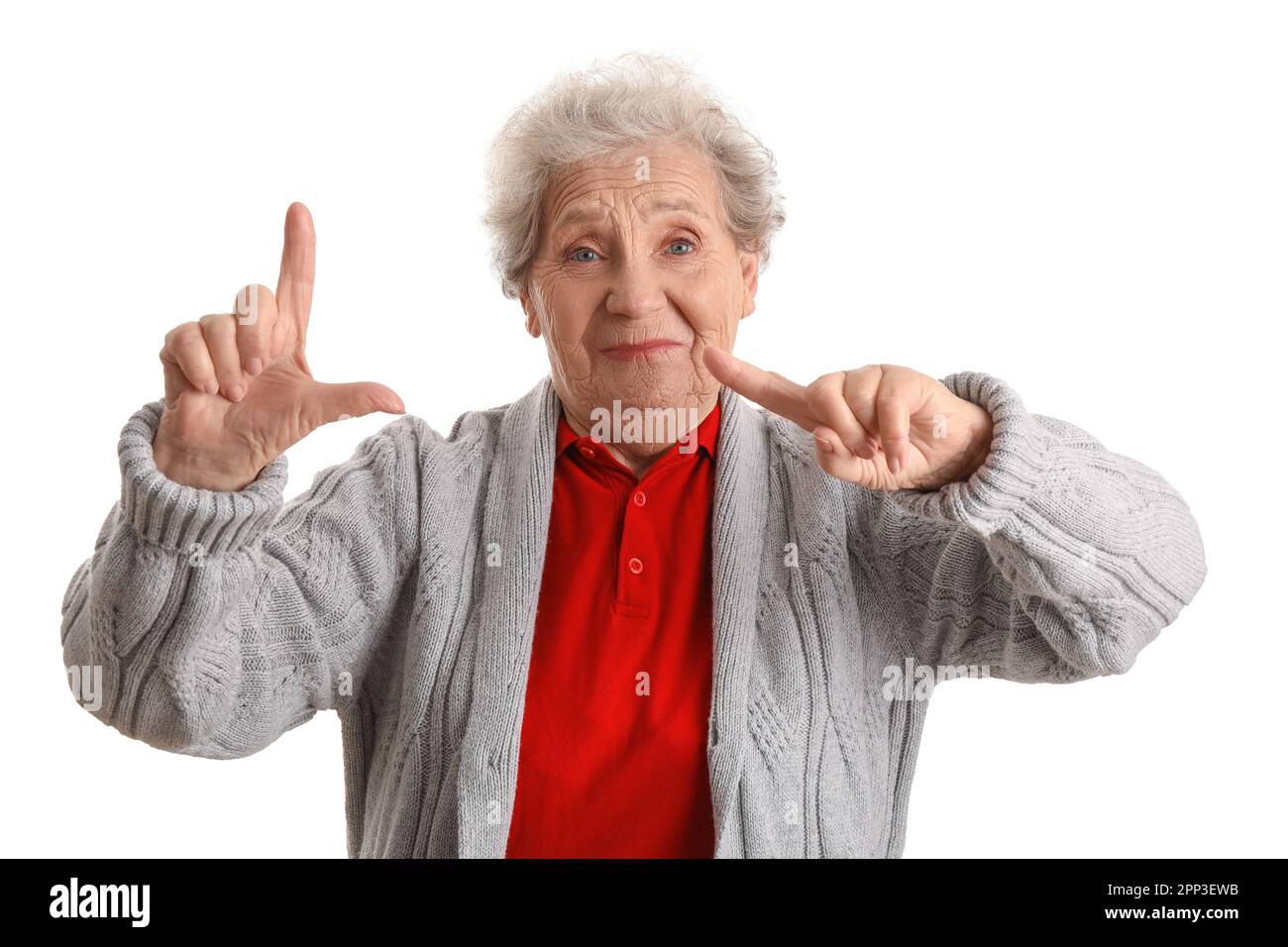 Senior woman showing loser gesture on white background Stock Photo - Alamy
