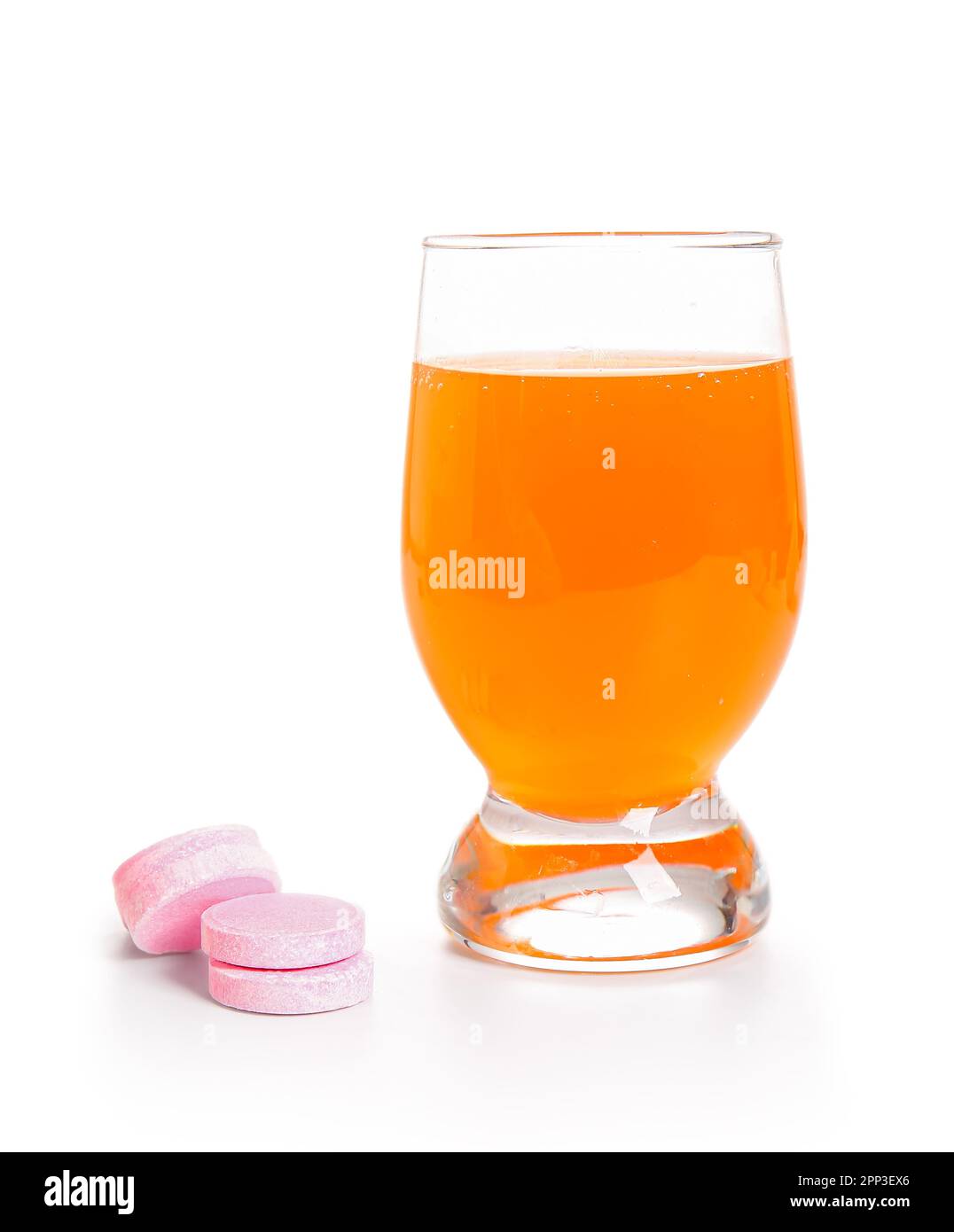 Glass of effervescent tablet dissolved in water and pills isolated on ...