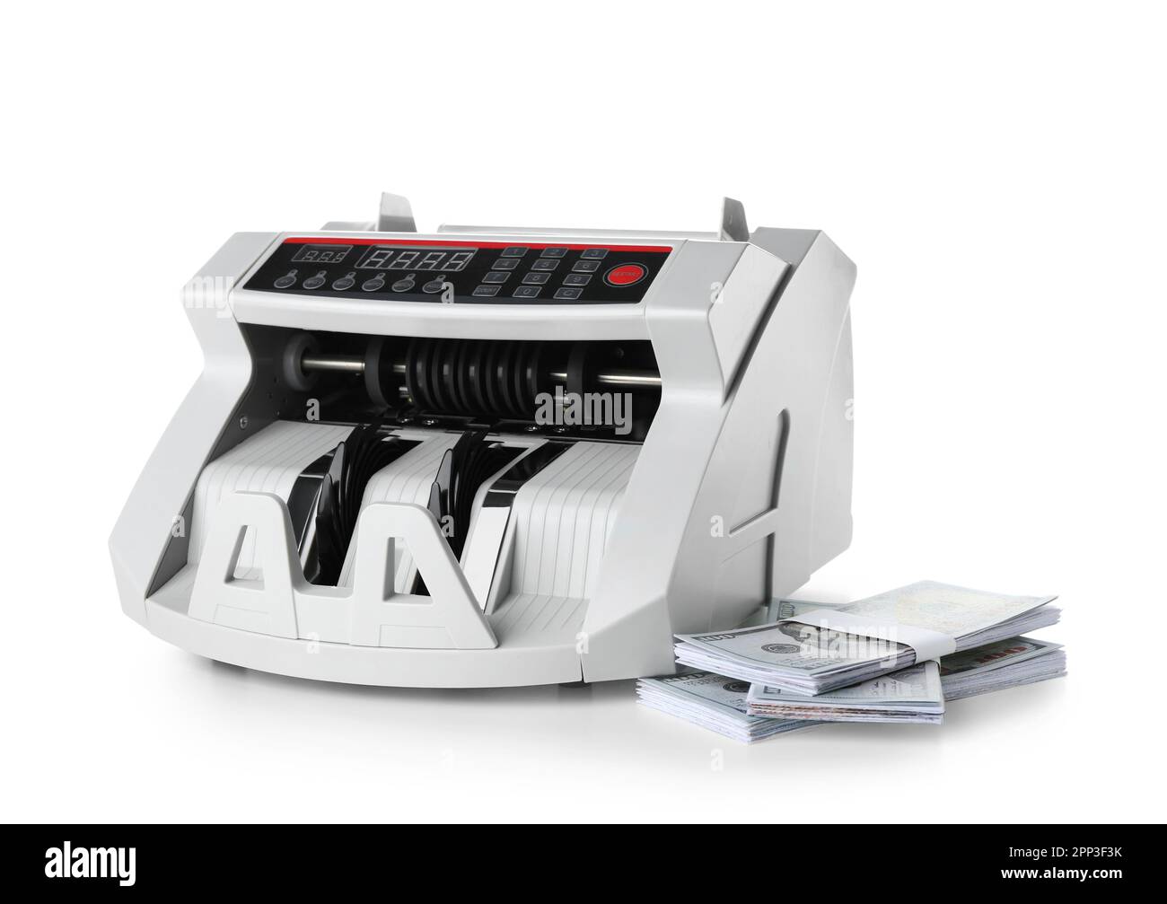 Modern cash counting machine with dollar banknotes on white background ...