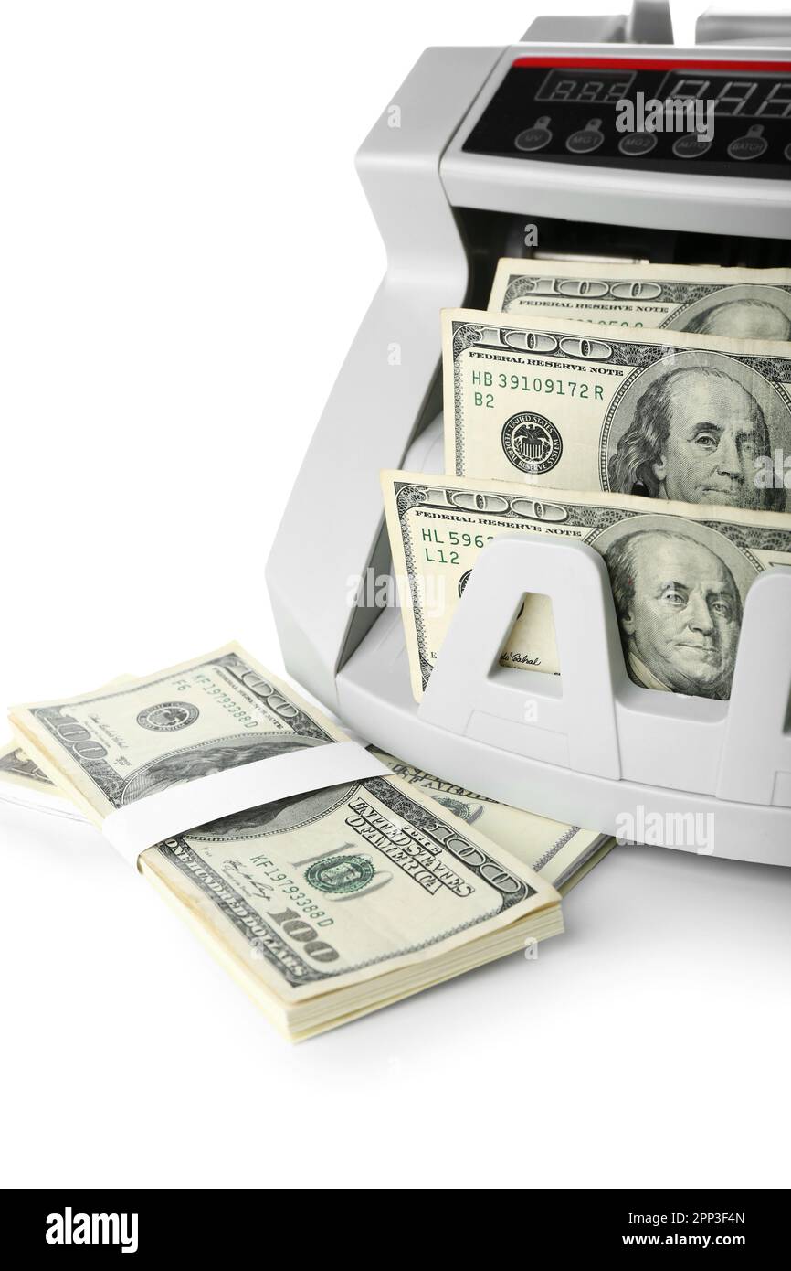 Modern cash counting machine with dollar banknotes on white background ...