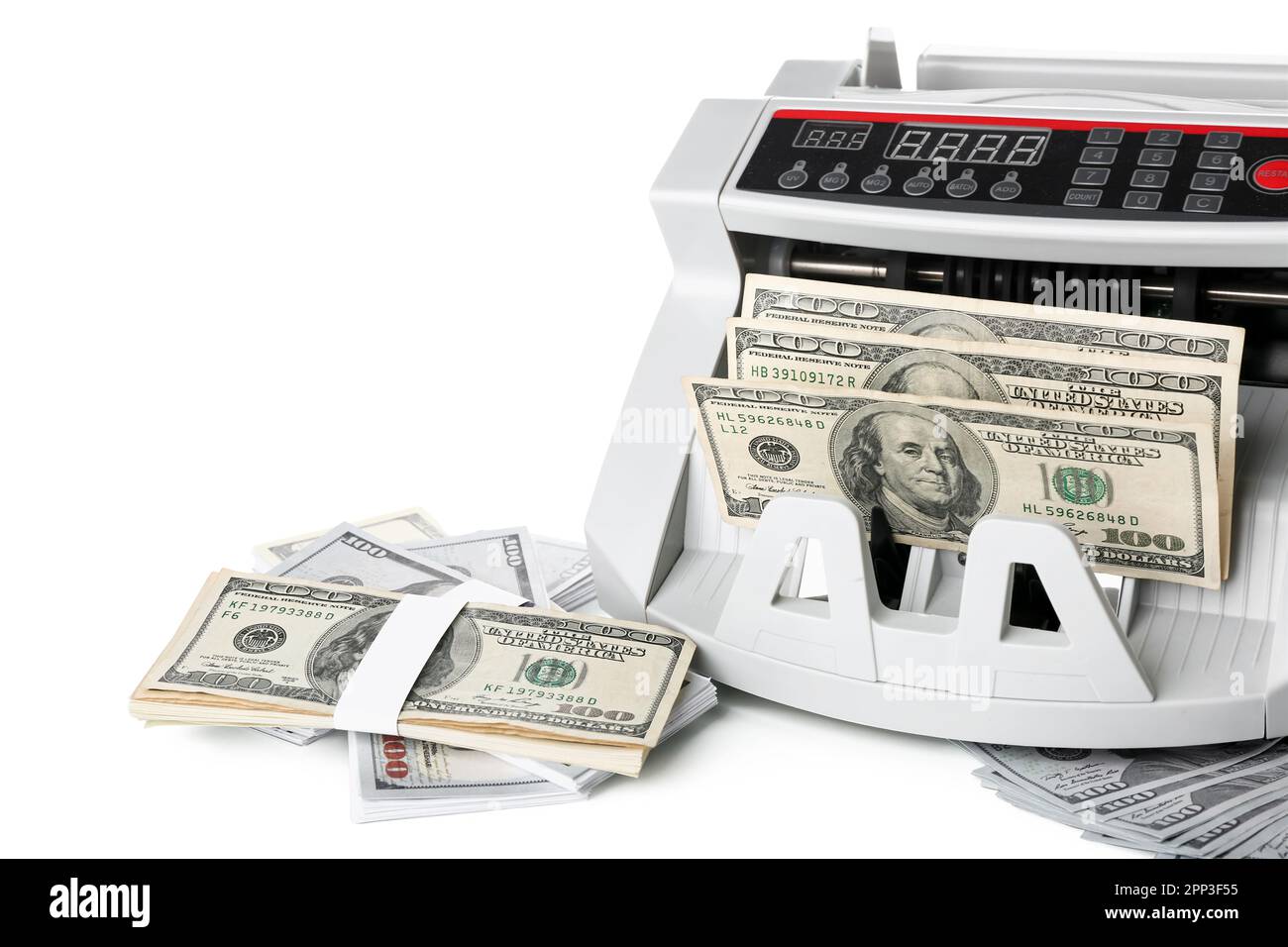 Modern cash counting machine with dollar banknotes on white background ...