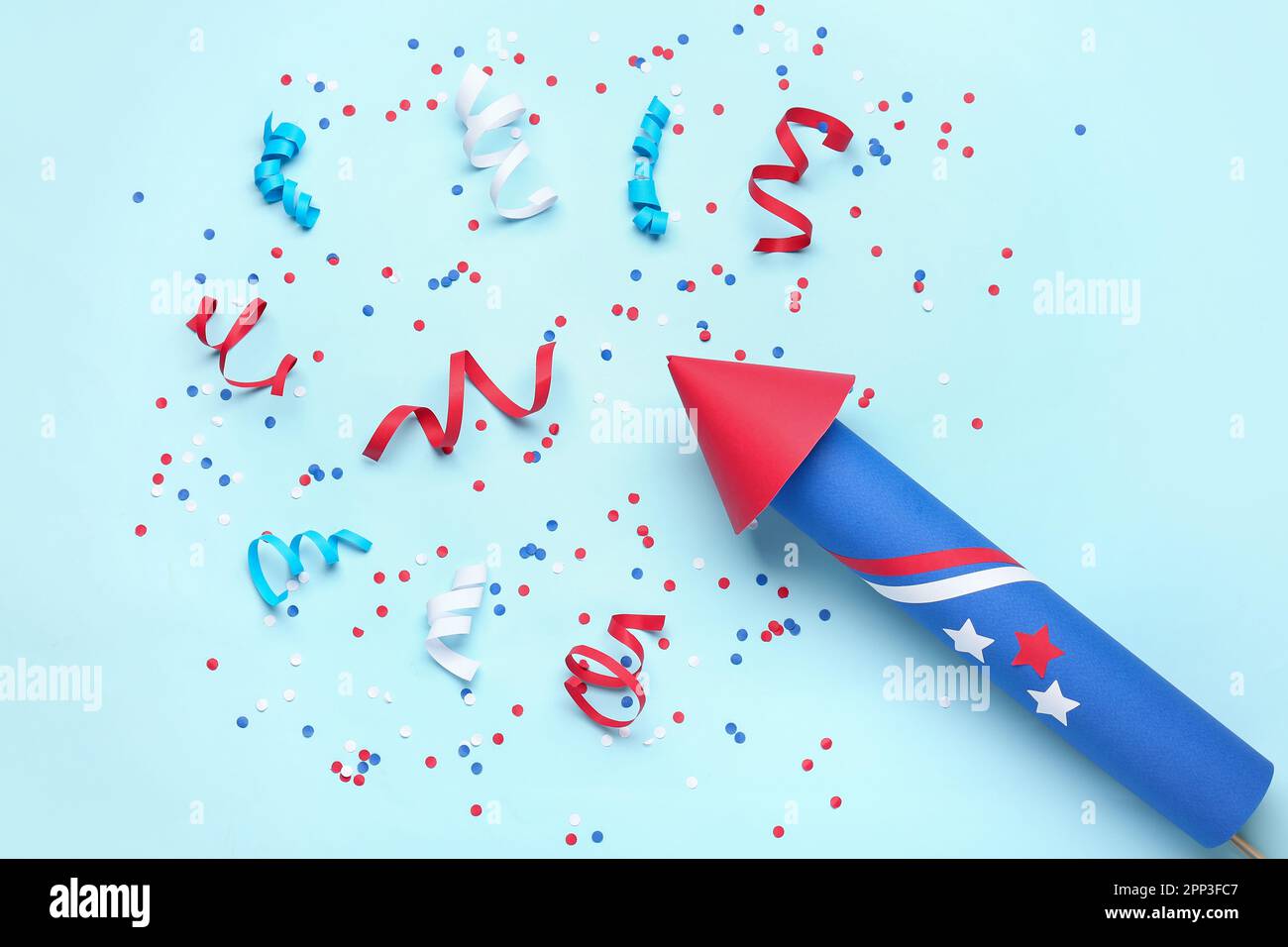 Firework rocket, confetti and serpentine for Independence Day on blue ...