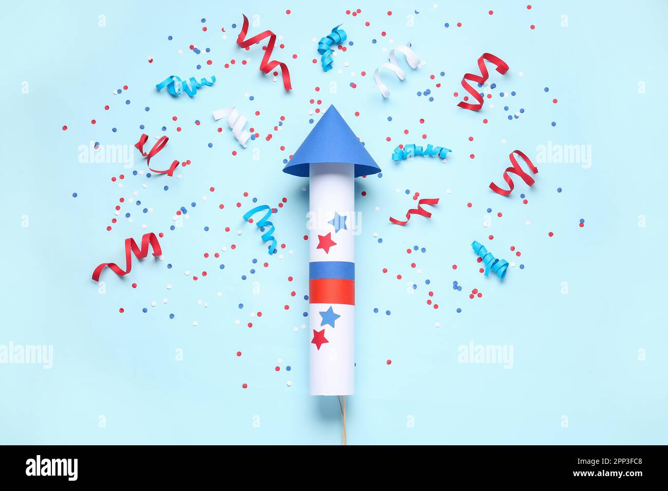 Firework rocket, confetti and serpentine for Independence Day on blue ...