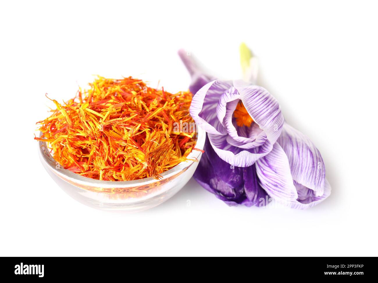 Bowl of dried saffron threads and crocus flowers isolated on white ...