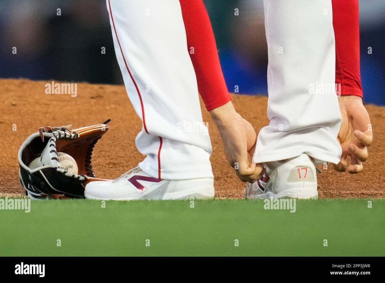 Los Angeles Angels starting pitcher Shohei Ohtani (17) adjusts his pant ...