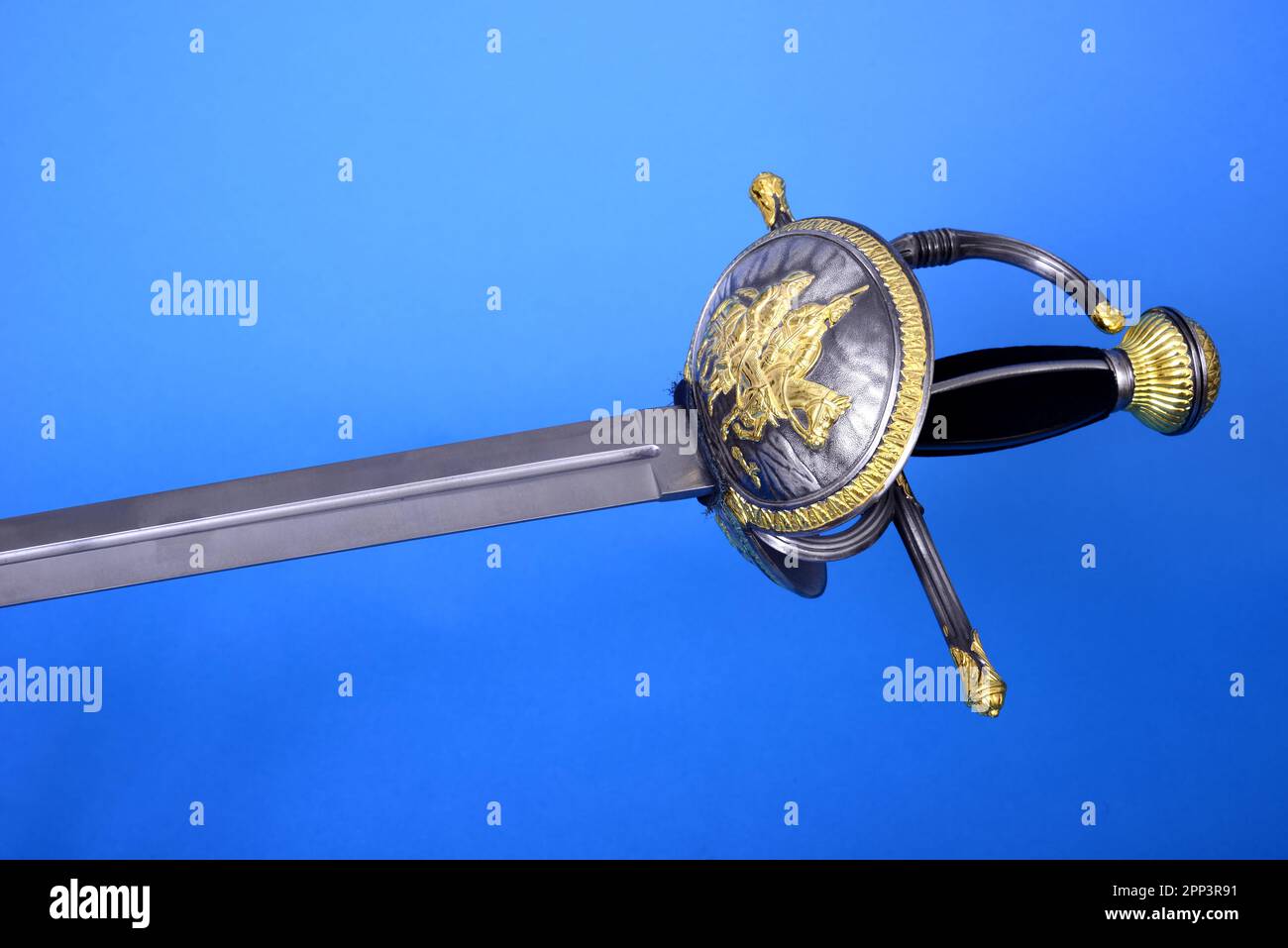 Sword hilt pommel blade and handle isolated over blue Stock Photo - Alamy
