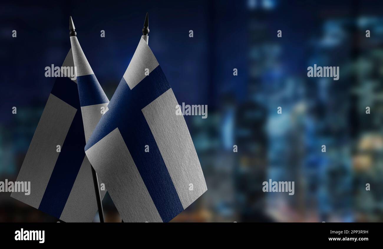 Small flags of the Finland on an abstract blurry background Stock Photo ...