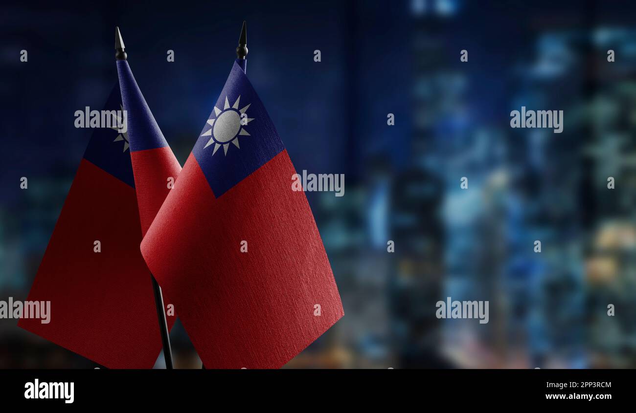 Small flags of the Taiwan on an abstract blurry background Stock Photo ...