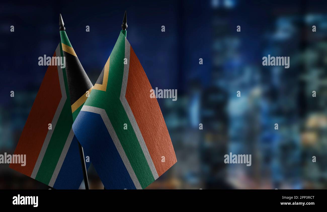 Small flags of the South Africa on an abstract blurry background Stock ...