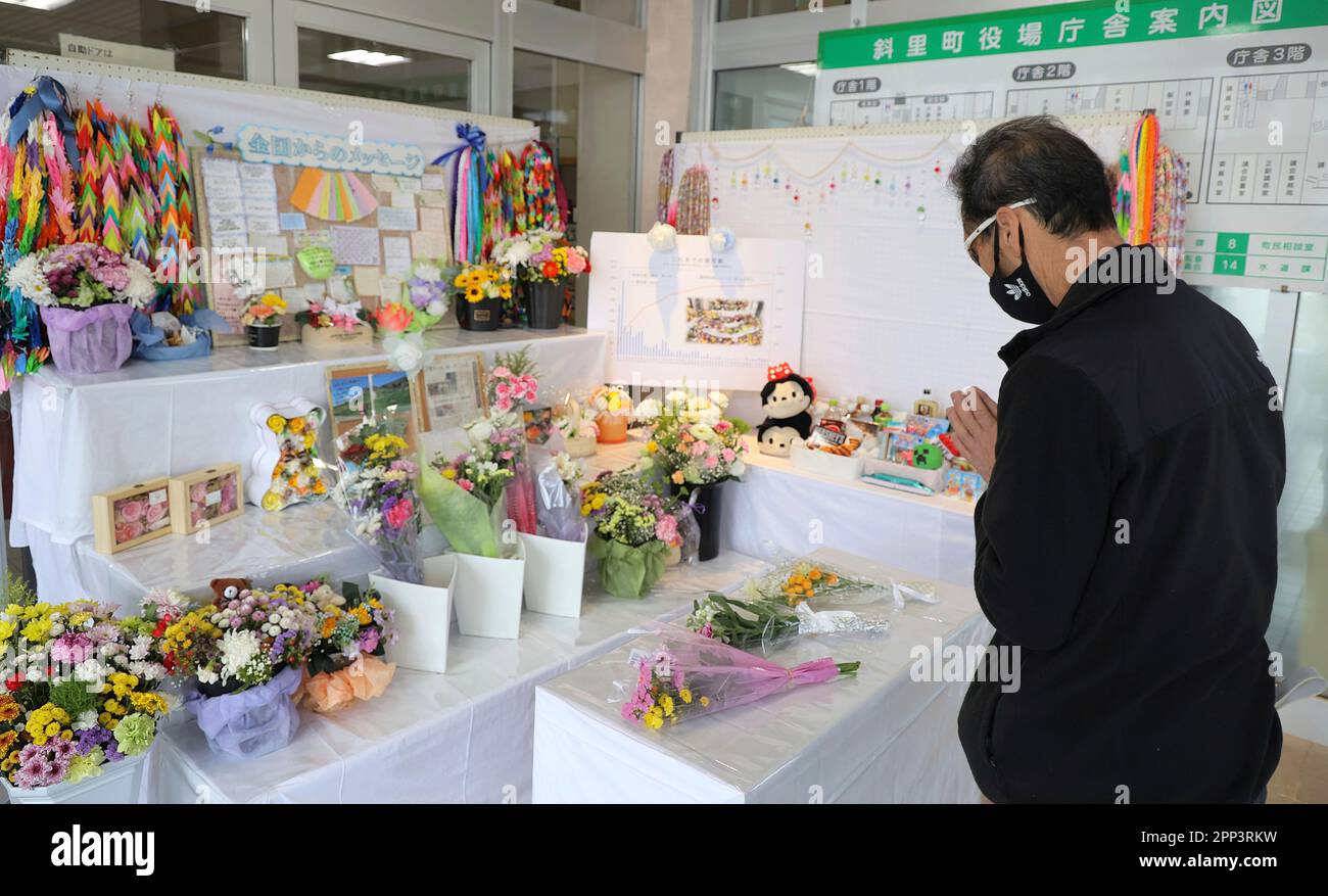 A man prays for victims of the accident at Shari Town Hall in Hokkaido ...