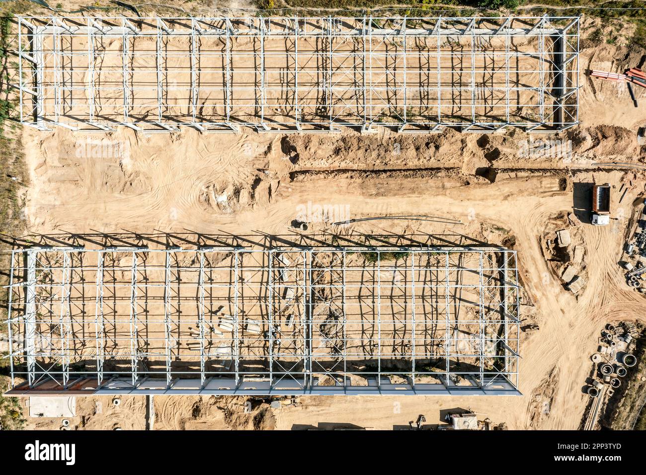 steel frame construction of modern warehouse or factory. aerial top ...