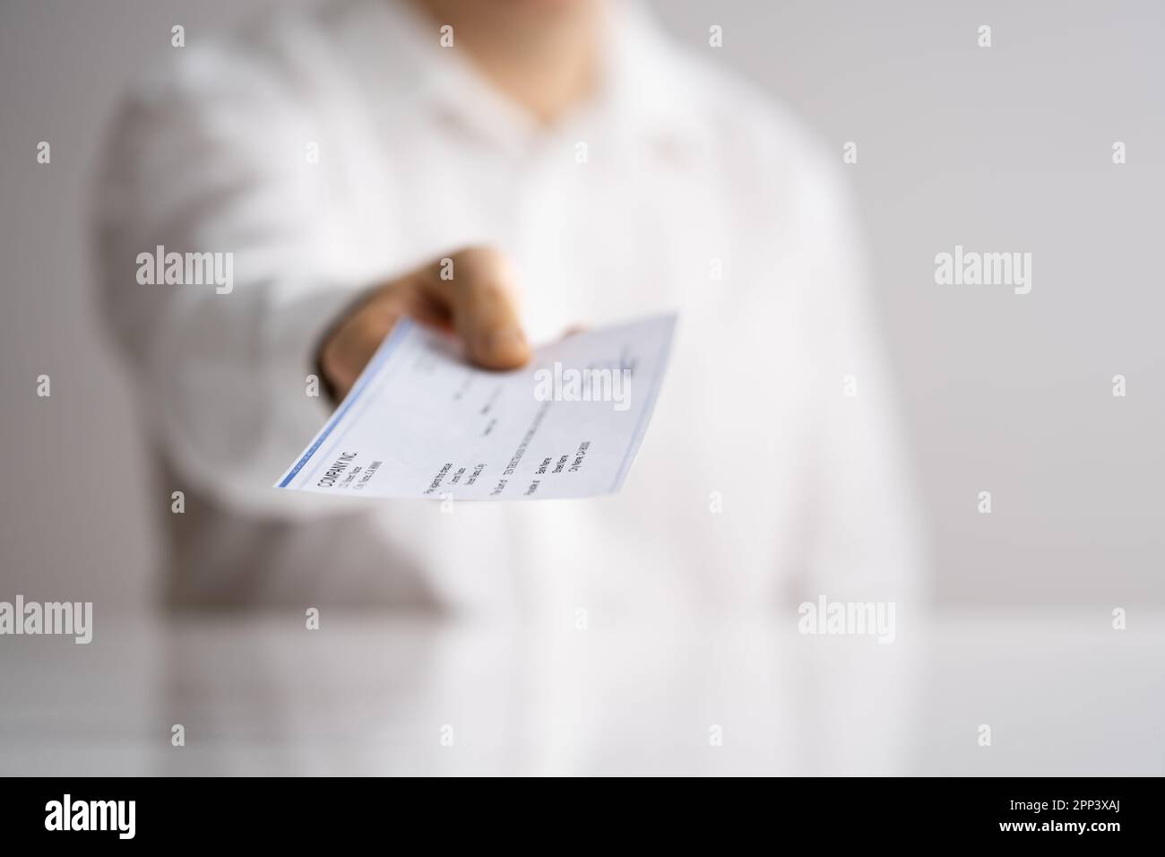 Giving Paycheck Or Payroll Cheque. Rent Check Pay Stock Photo - Alamy