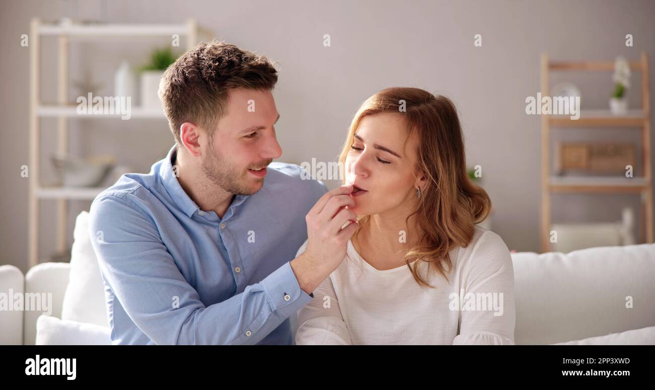 Woman and man eating chocolate hi-res stock photography and images - Alamy