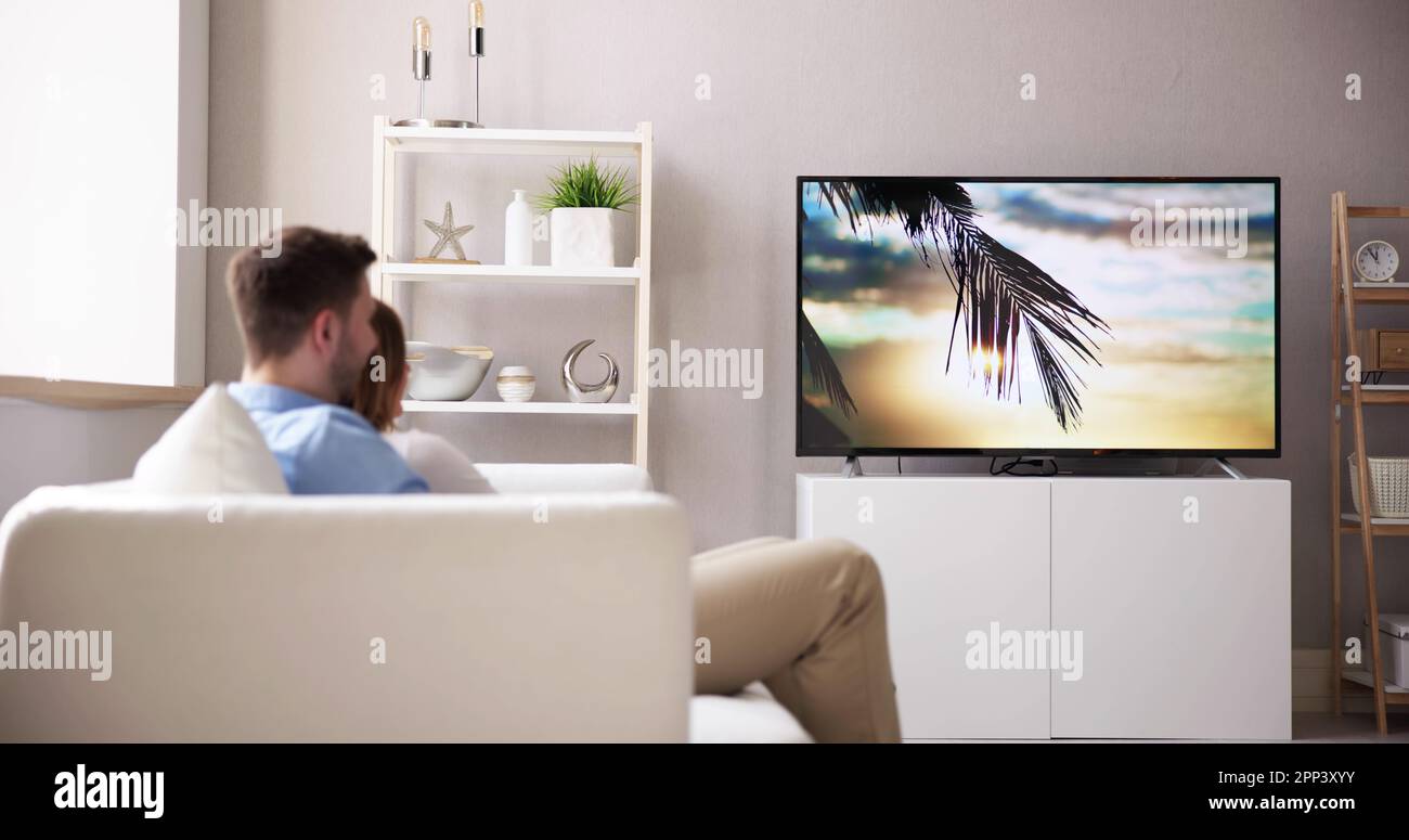 Rear view of a couple watching tv hi-res stock photography and images ...