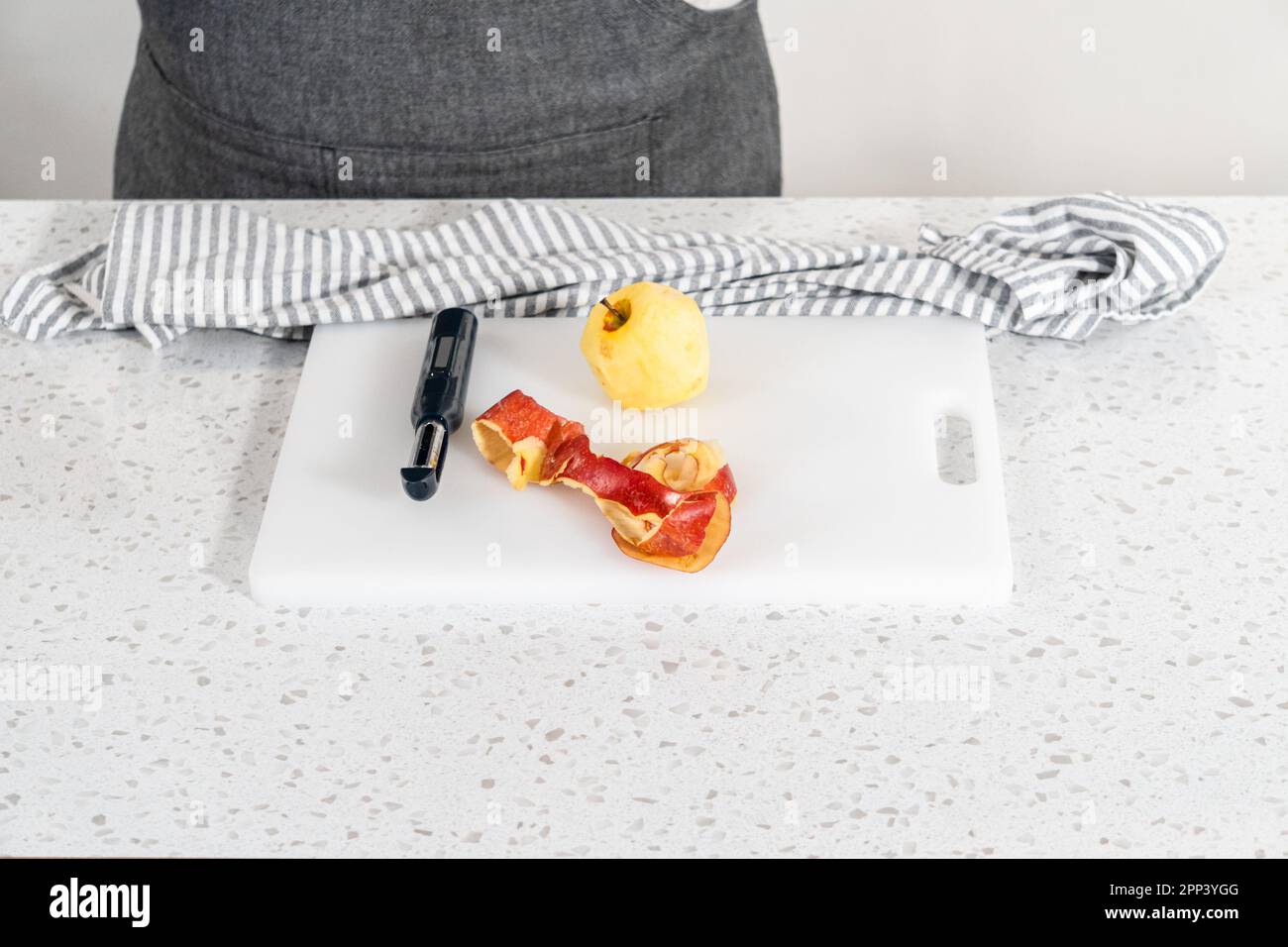 Peeling red apples Stock Photo - Alamy