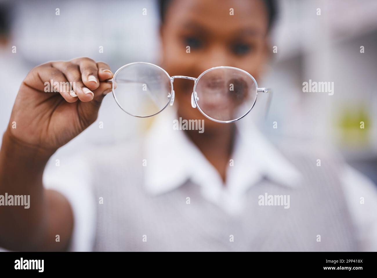 Eye care, hand and woman holding frame in clinic for health, vision and ...