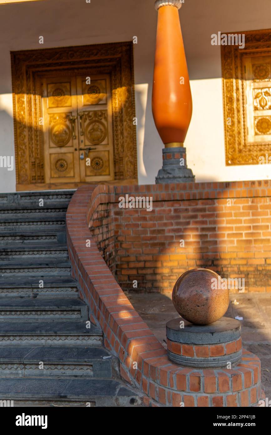 Outdoor main staircase with stone stairs and natural wood rails. A big ...